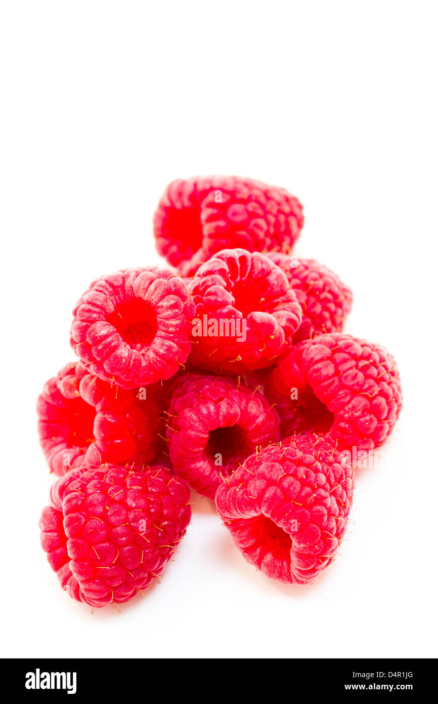 Heap of organic raspberries on white background Stock Photo - Alamy