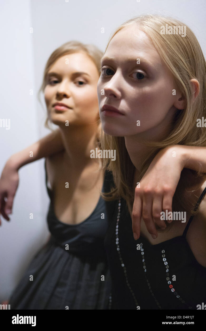 Young woman with arm around friend's shoulder, portrait Stock Photo - Alamy