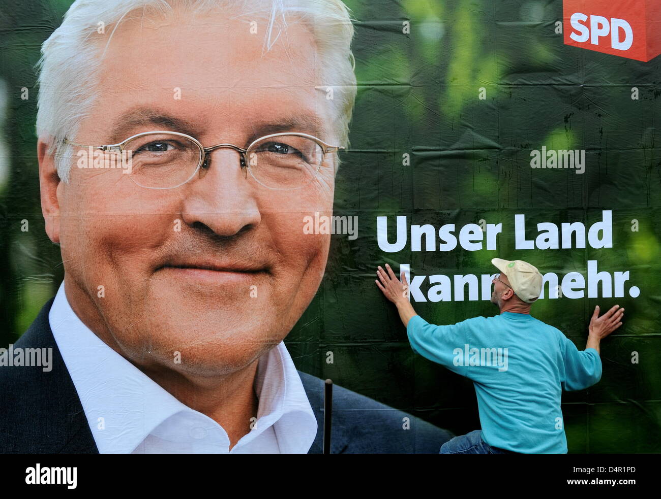 A bill poster posts a new election posters of the Social Democratic ...