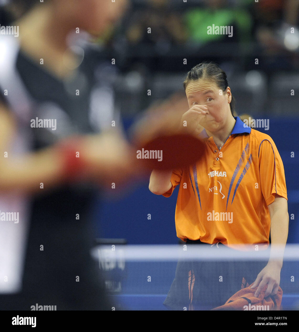 Dutch Li Jiao (back) waits for a service during her women?s team final ...