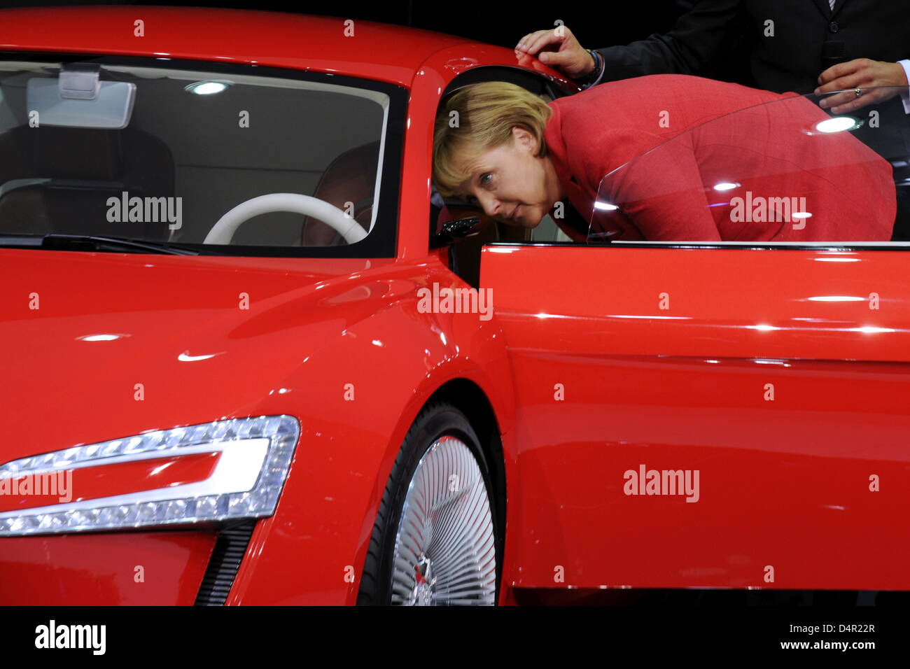 German Chancellor Angela Merkel eyes Audi?s R8 e-tron as she visits the ...