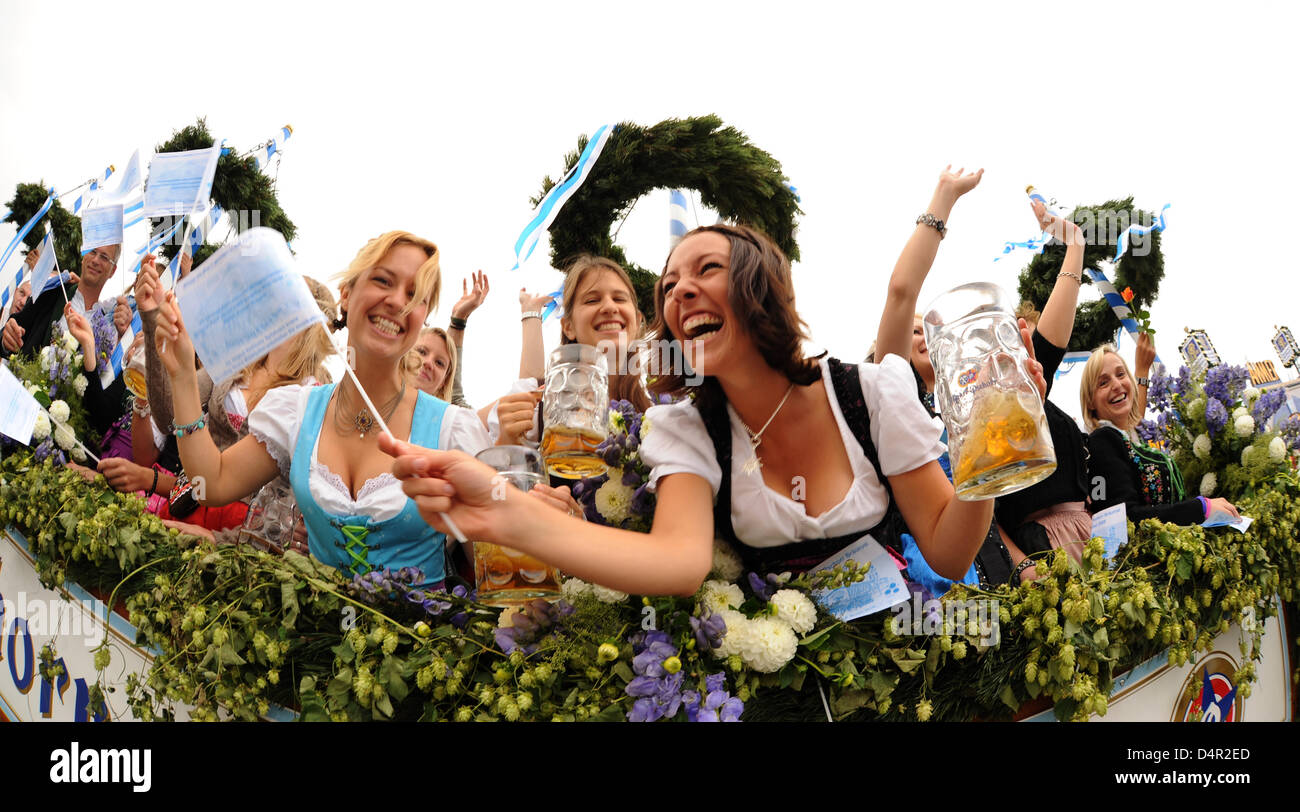 Visitors celebrate duirng the ceremonial entry of the Oktoberfest ...