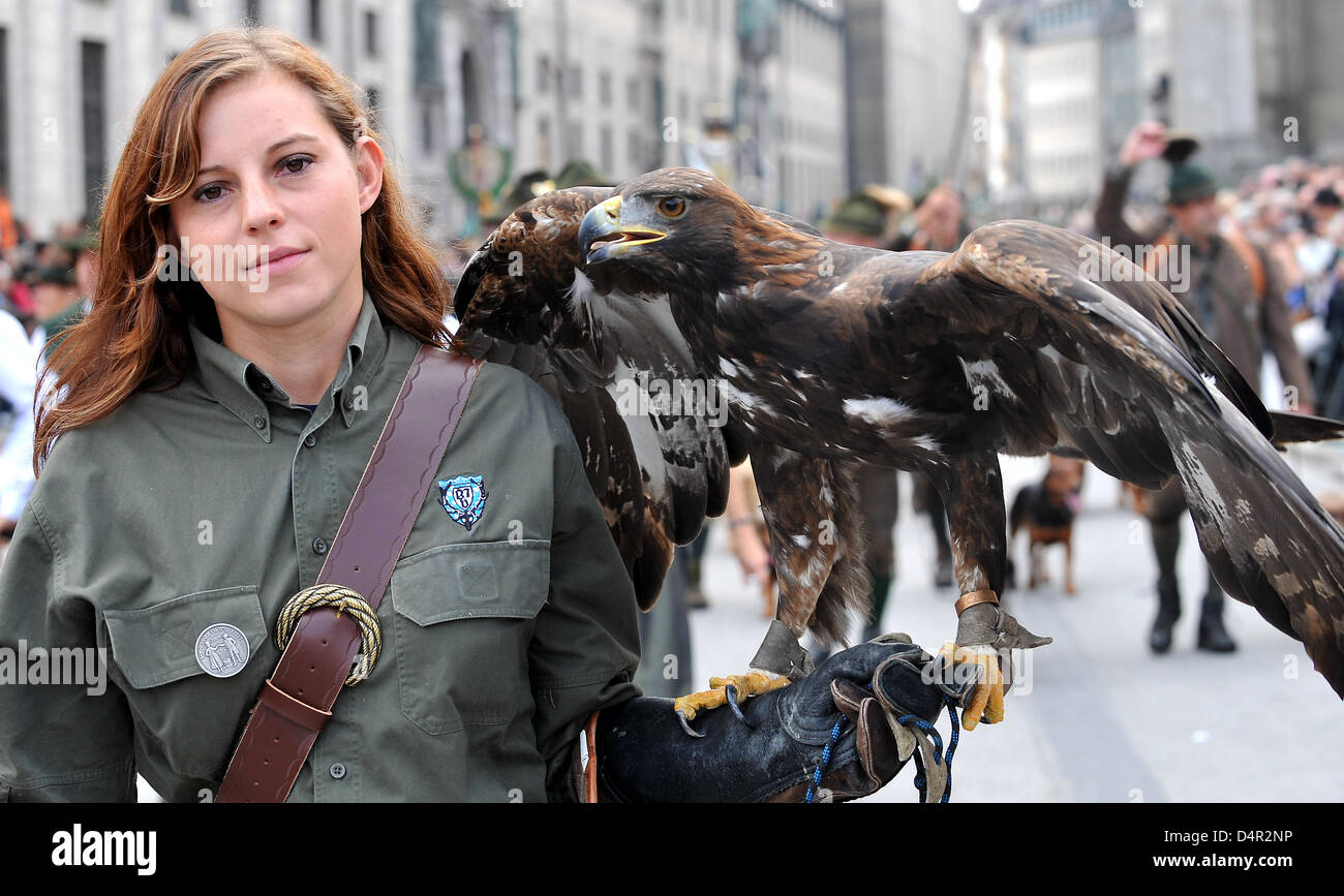 A falconer participates in the traditional costume and shooting ...