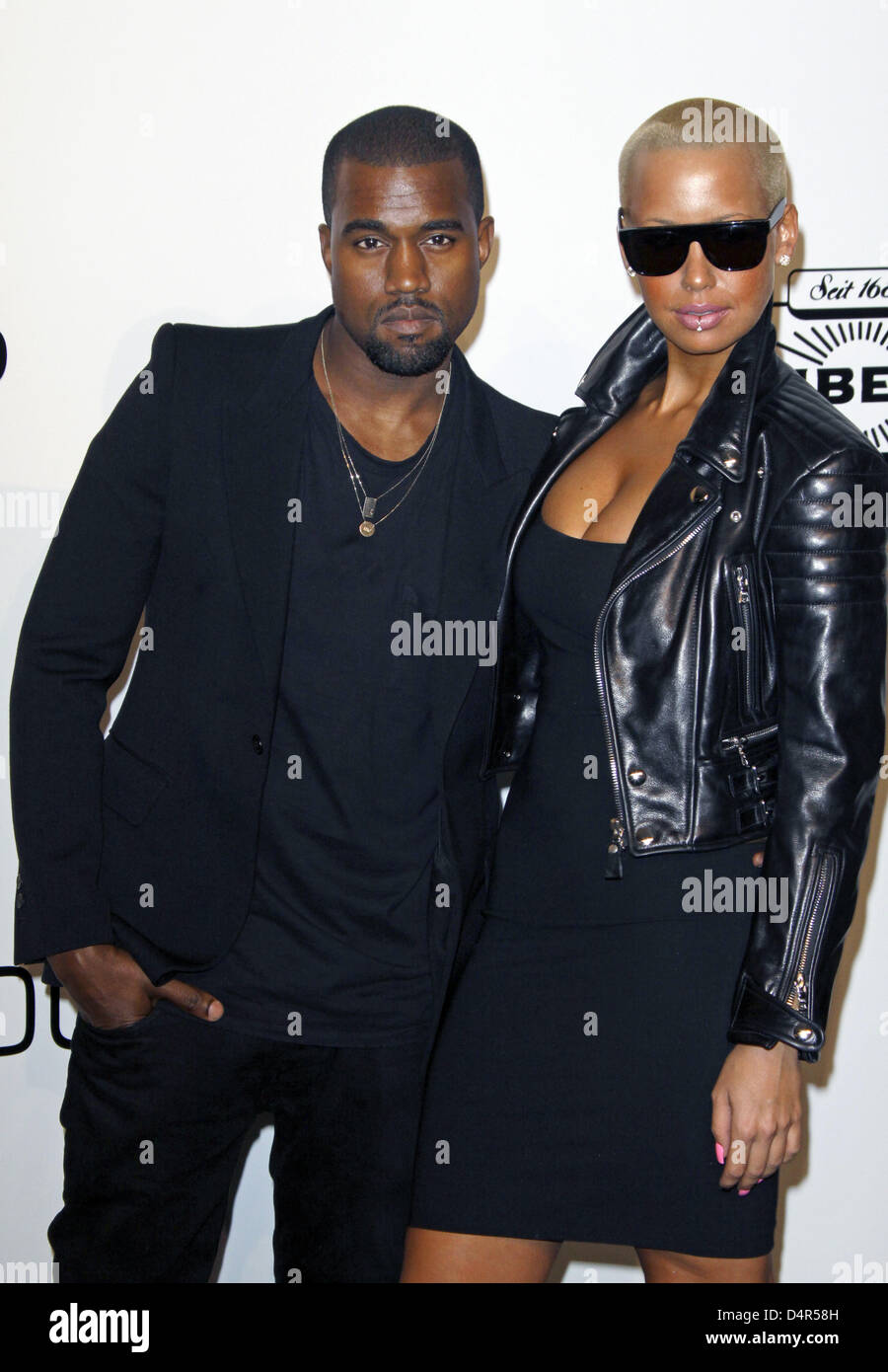 US musician Kanye West (L) and his girlfriend Amber Rose (R) arrive for ...