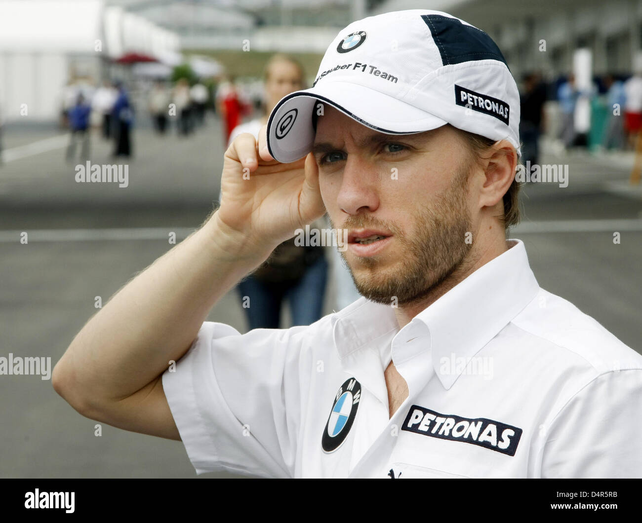 German Formula One driver Nick Heidfeld of BMW Sauber smiles in the ...