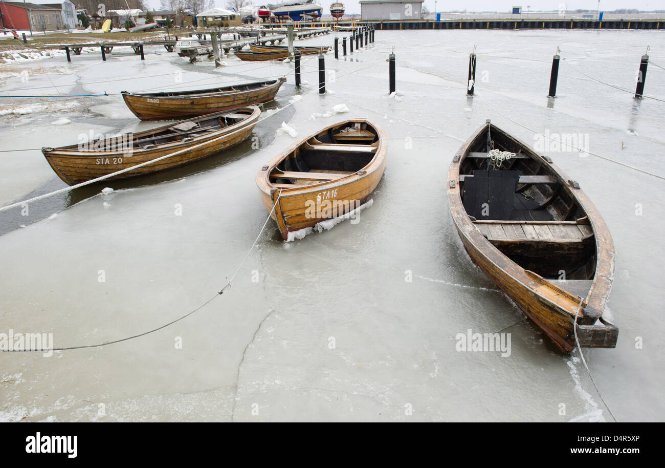 Fishing boats are stuck in the ice at the harbour of Stahlbrode at the ...