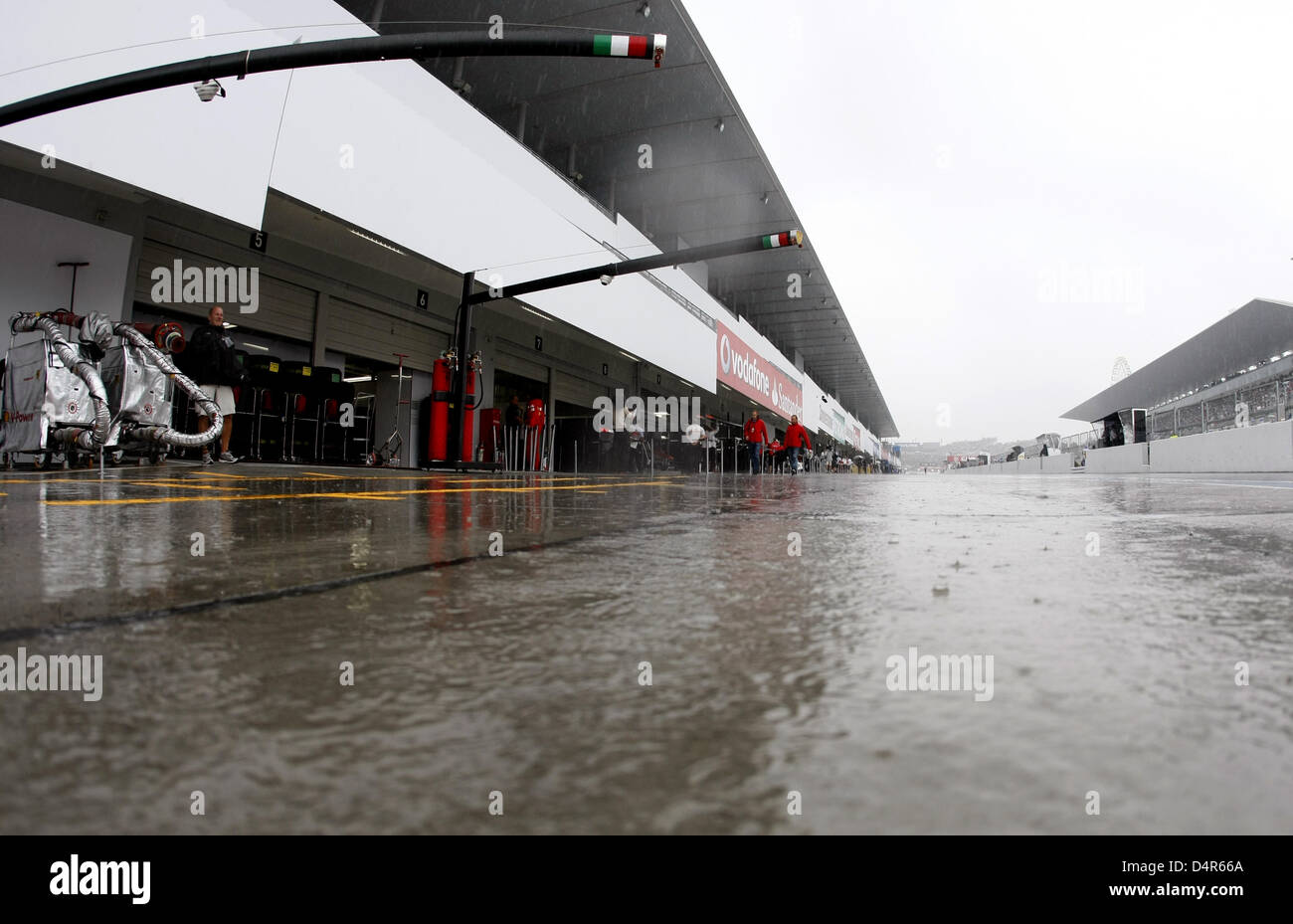 Rain falls on the pit lane during the second practice session at Suzuka ...