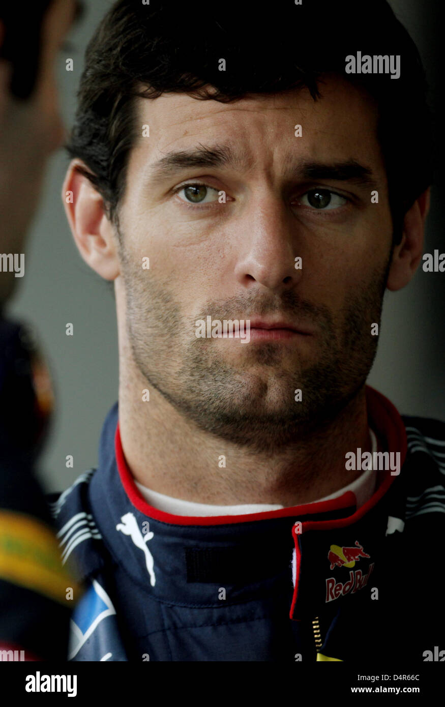 Australian Formula One driver Mark Webber of Red Bull Racing talks to a ...