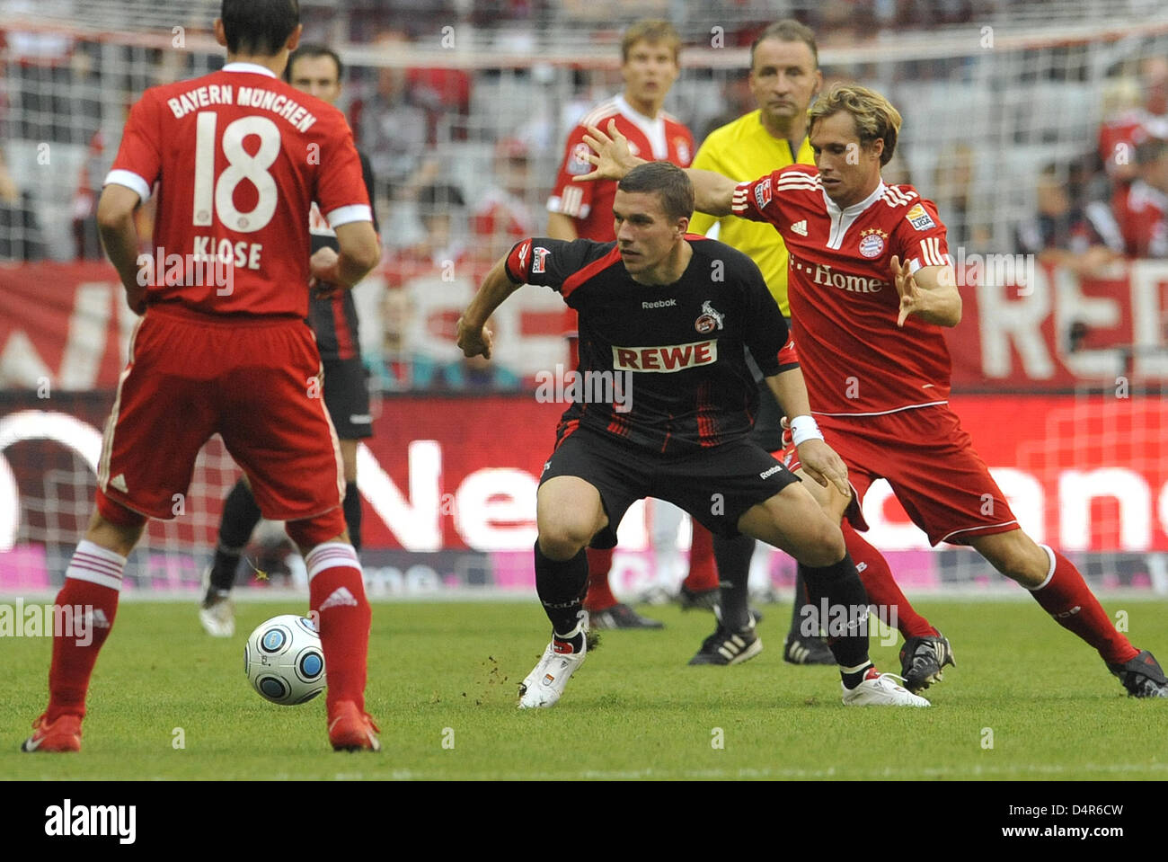 Cologne?s Lukas Podolski (C) controls the ball during the German ...