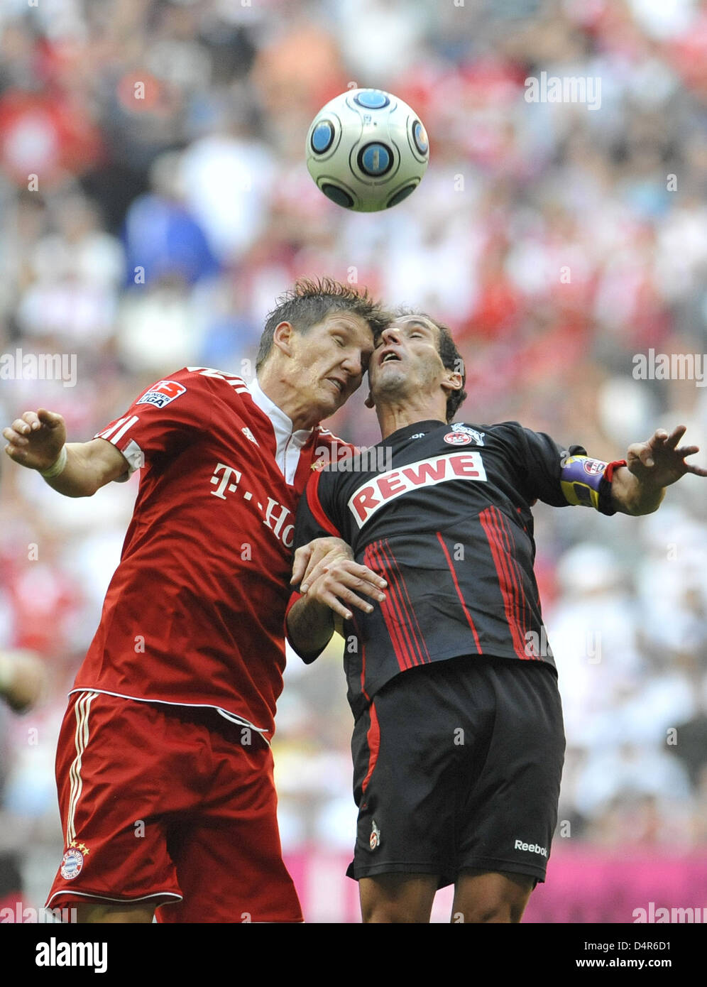 Cologne?s Petit (R) and Bayern Munich?s Bastian Schweinsteiger (L) rise ...