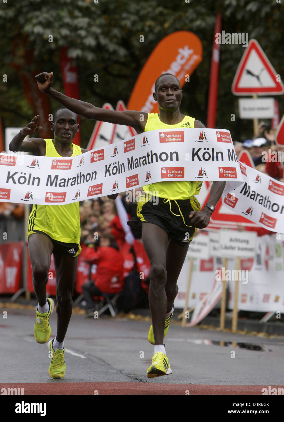 Kenyan Evans Kipkosgei Ruto (R) wins the Cologne Marathon followed by ...