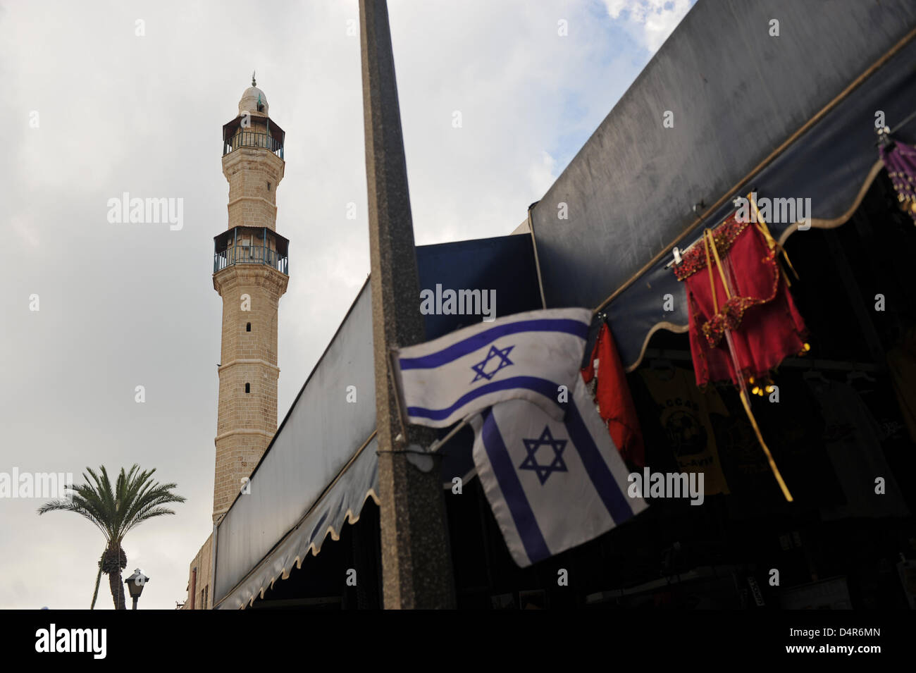 Islamic flags fly below the minaret of a mosque in Old Jaffa, the ...