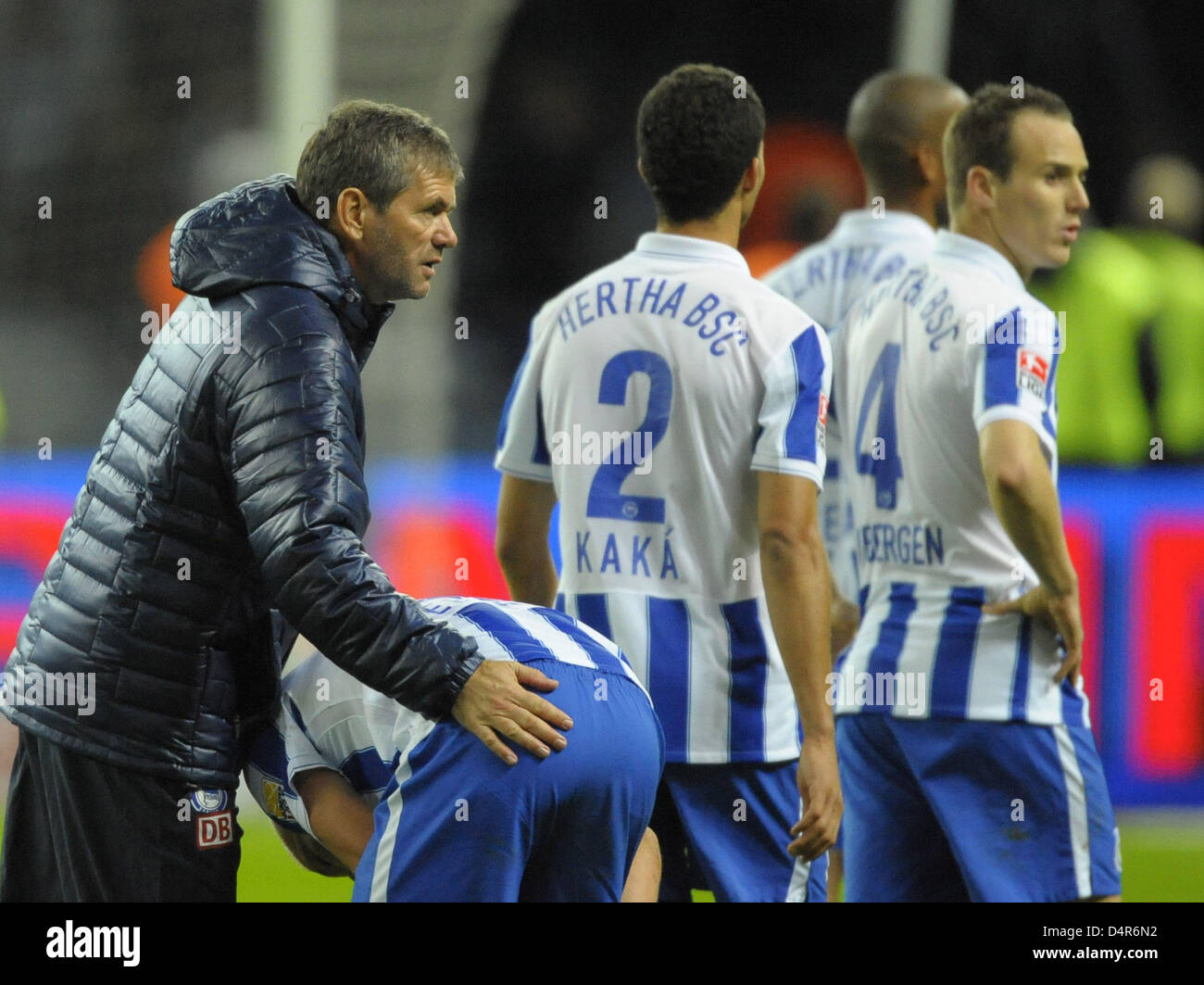 Berlin?s coach Friedhelm Funkel consoles his players after the German ...