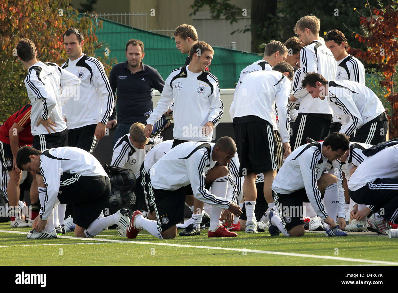 The German national team puts on their shoes for a training on ...