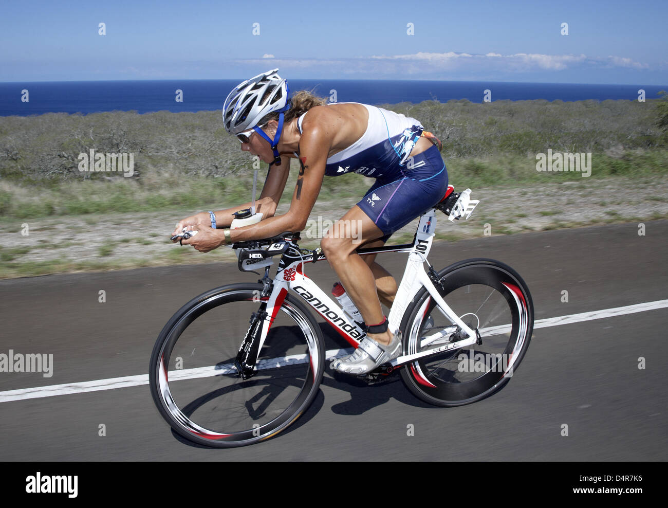 British triathlete Chrissie Wellington cycles during the Ironman ...