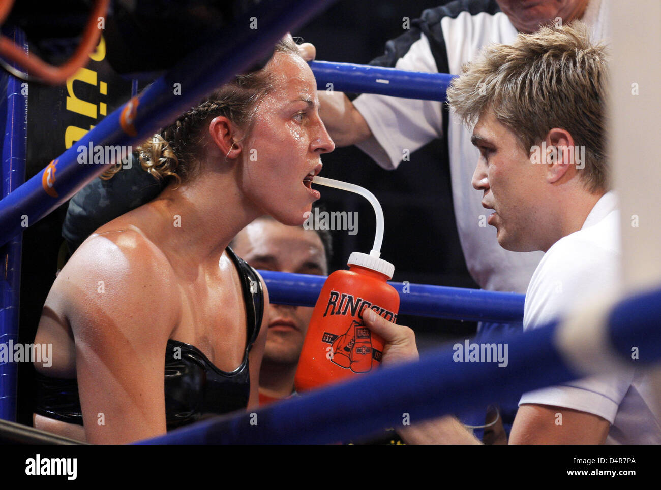 Dutch featherweight boxer Esther Schouten drinks during her fight ...