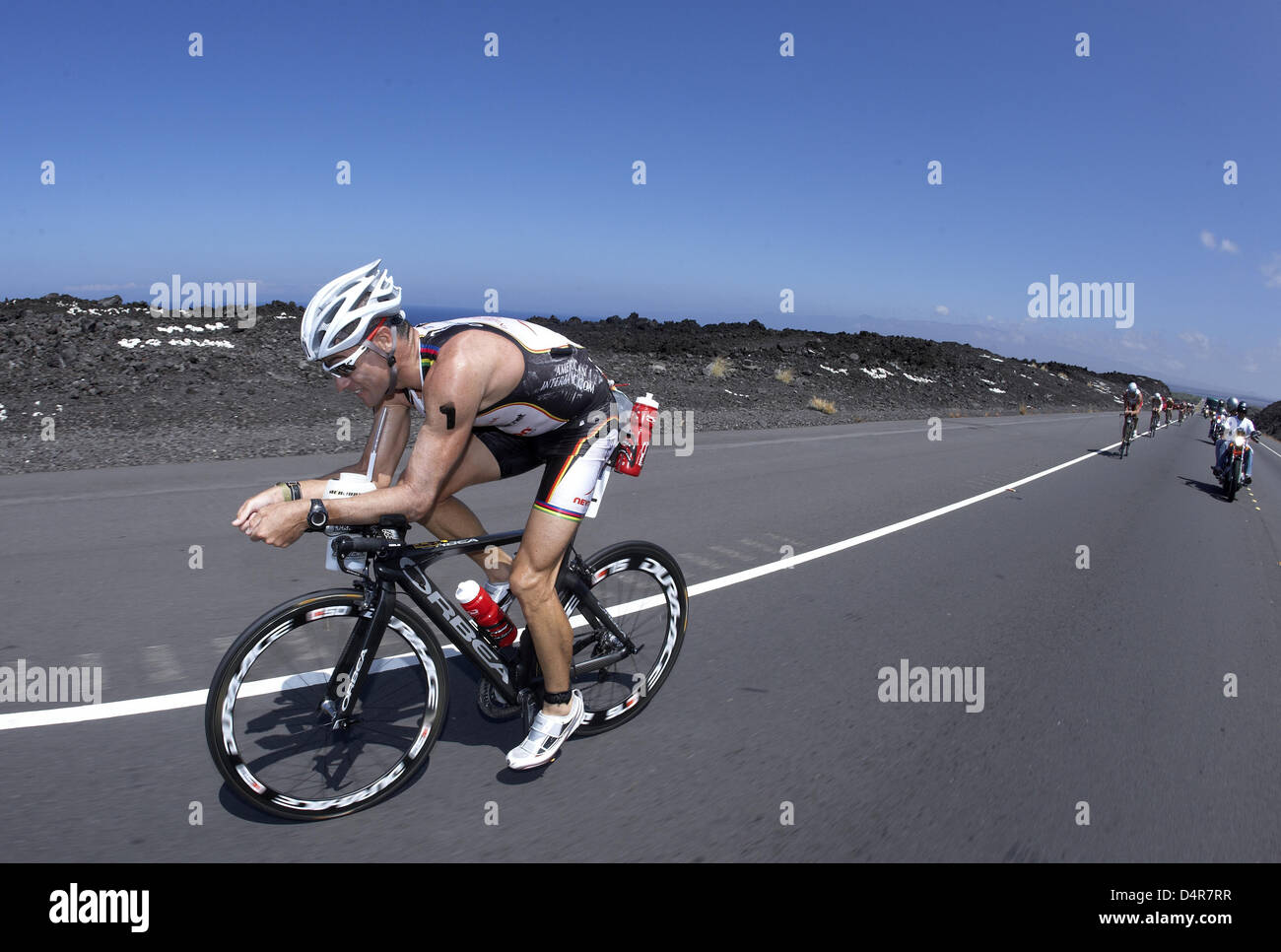 Australian triathlete Craig Alexander cycles during the Ironman ...