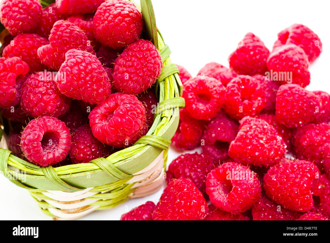 Heap of organic raspberries on white background Stock Photo - Alamy