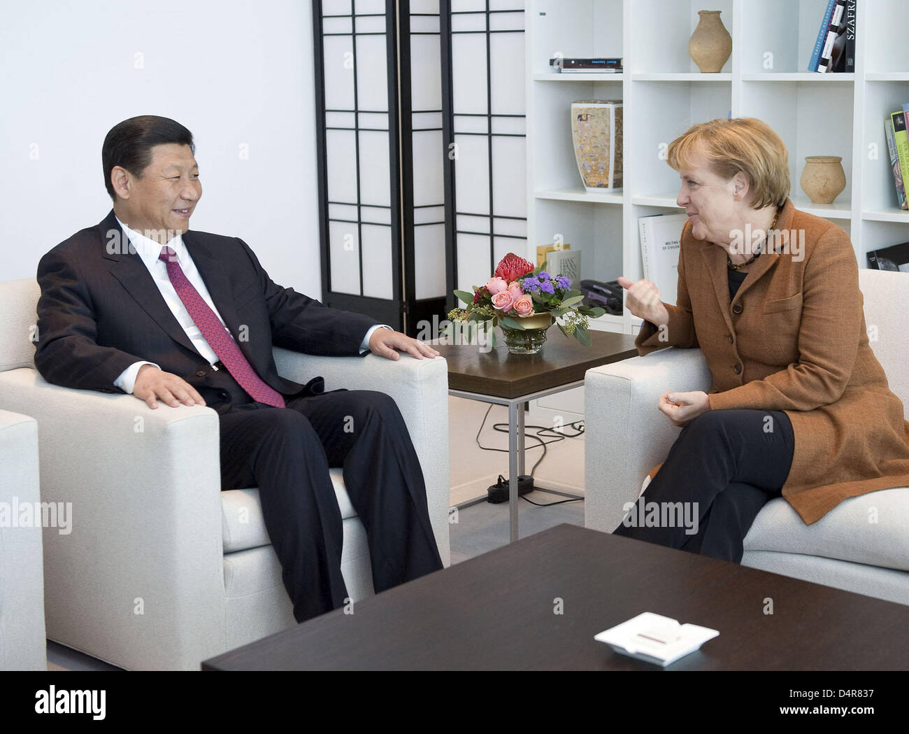 German Chancellor Angela Merkel (R) and Chinese Vice President Xi ...