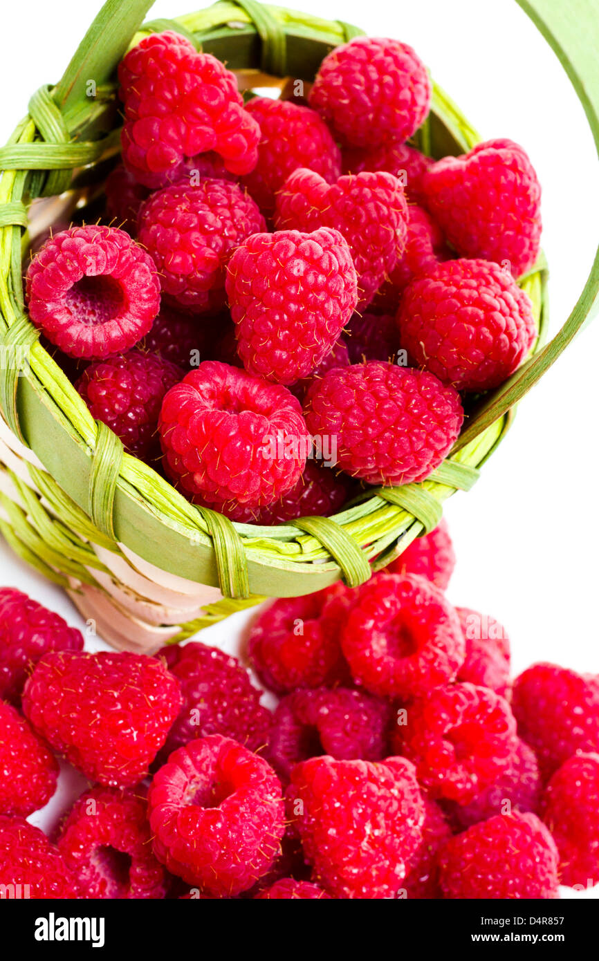Heap of organic raspberries on white background Stock Photo - Alamy