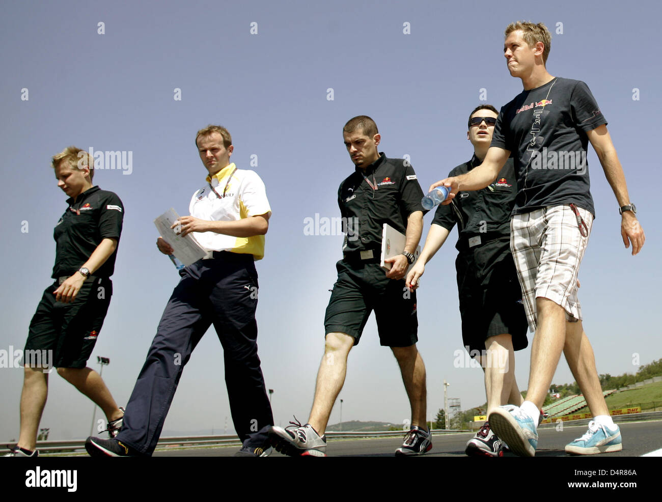German Formula One driver Sebastian Vettel (R) of Red Bull Racing, his ...