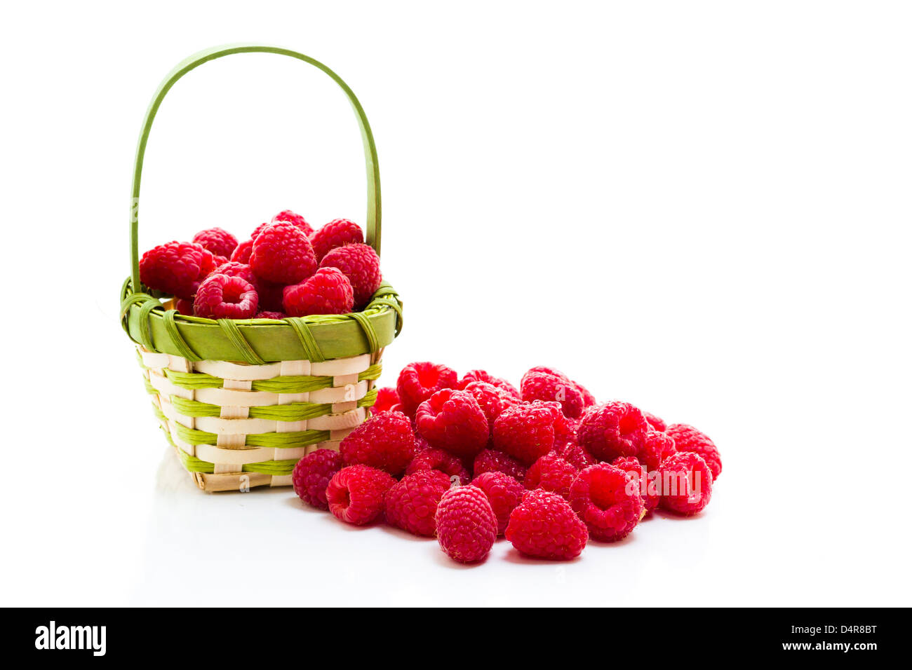 Heap of organic raspberries on white background Stock Photo - Alamy
