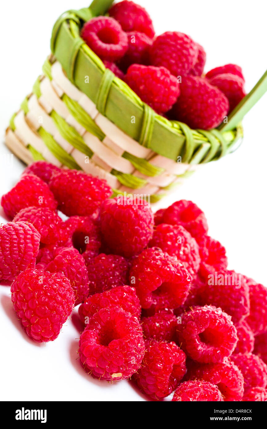 Heap of organic raspberries on white background Stock Photo - Alamy