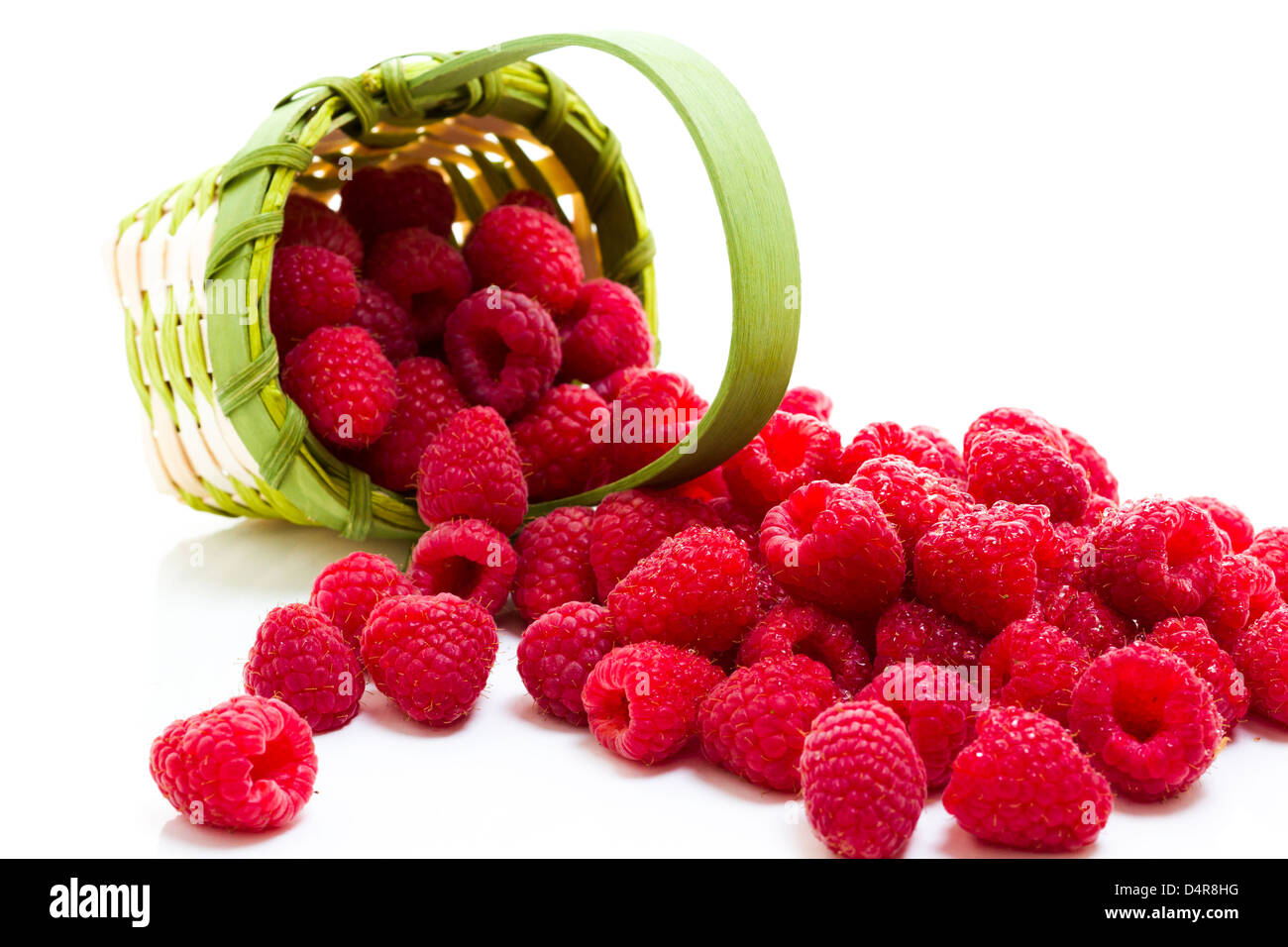 Heap of organic raspberries on white background Stock Photo - Alamy