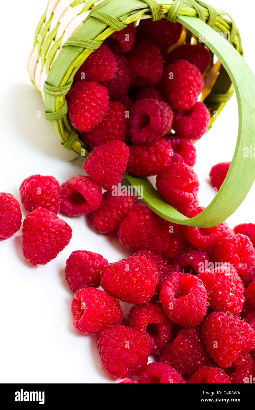 Heap of organic raspberries on white background Stock Photo - Alamy
