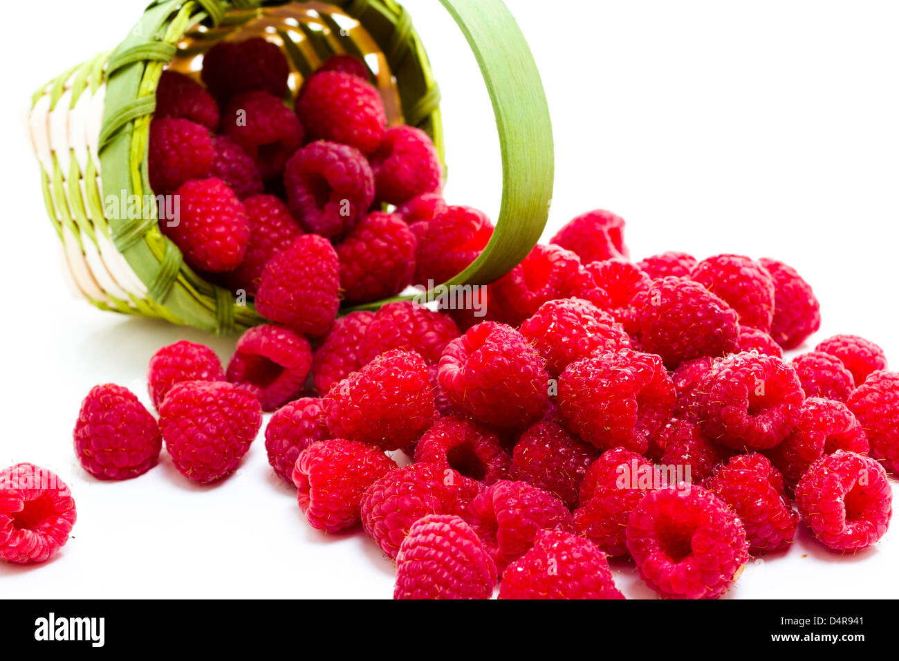 Heap of organic raspberries on white background Stock Photo - Alamy