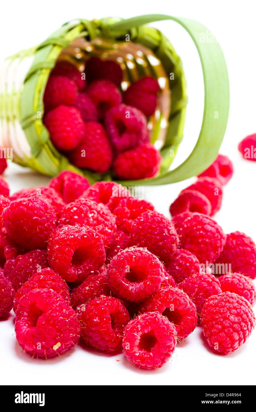 Heap of organic raspberries on white background Stock Photo - Alamy
