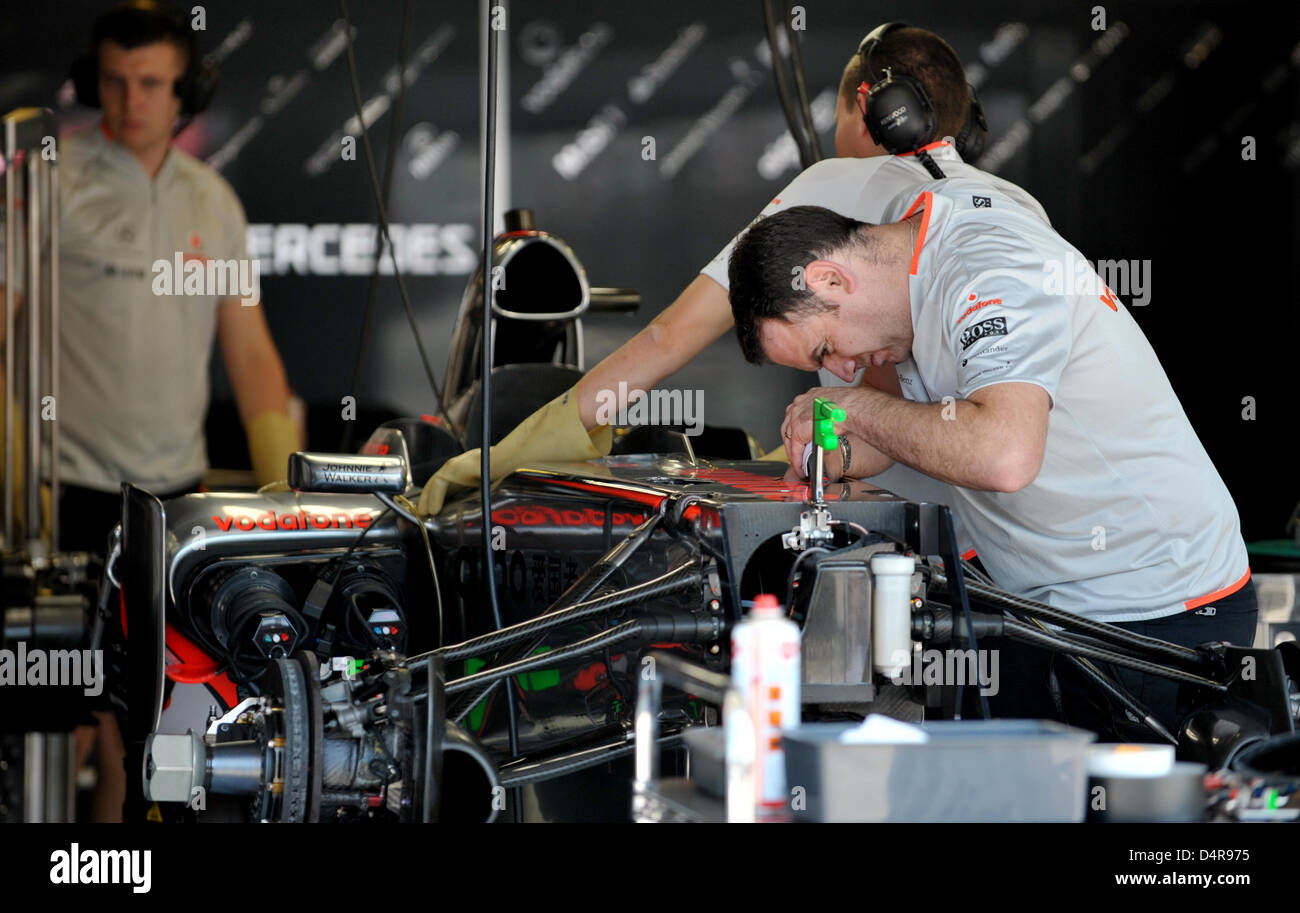 Mechanics of McLaren Mercedes prepare are race car at Hungaroring race ...