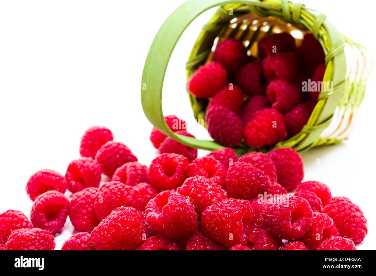 Heap of organic raspberries on white background Stock Photo - Alamy