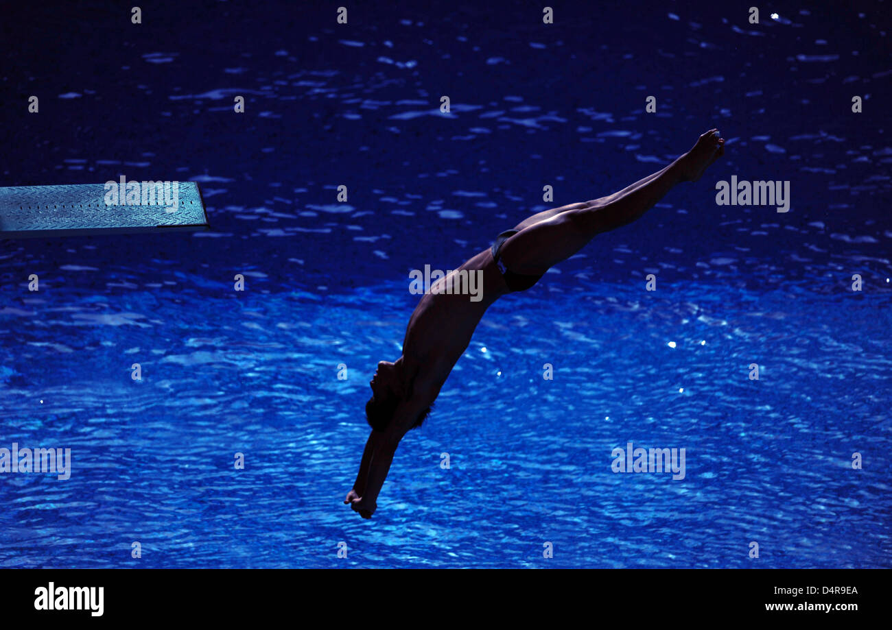 A diver performs during the 3m diving competition at the FINA Swimming ...