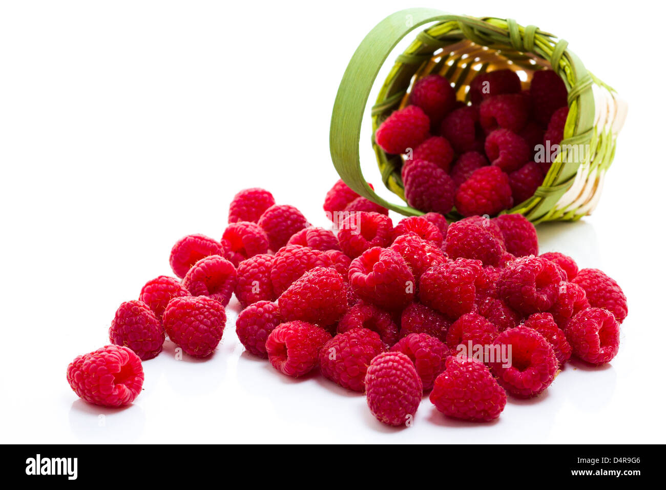 Heap of organic raspberries on white background Stock Photo - Alamy