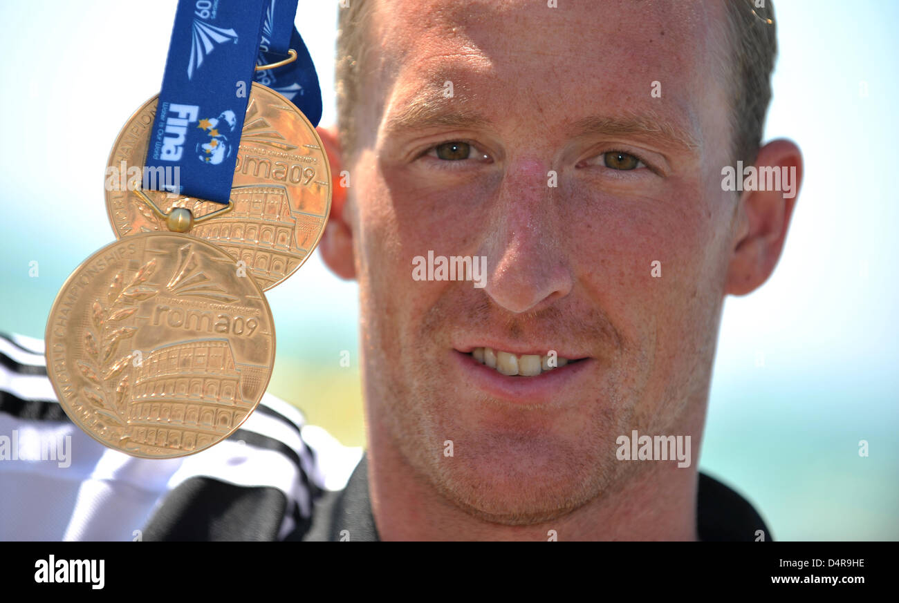 German open water swimmer Thomas Lurz poses with his two gold medals in ...