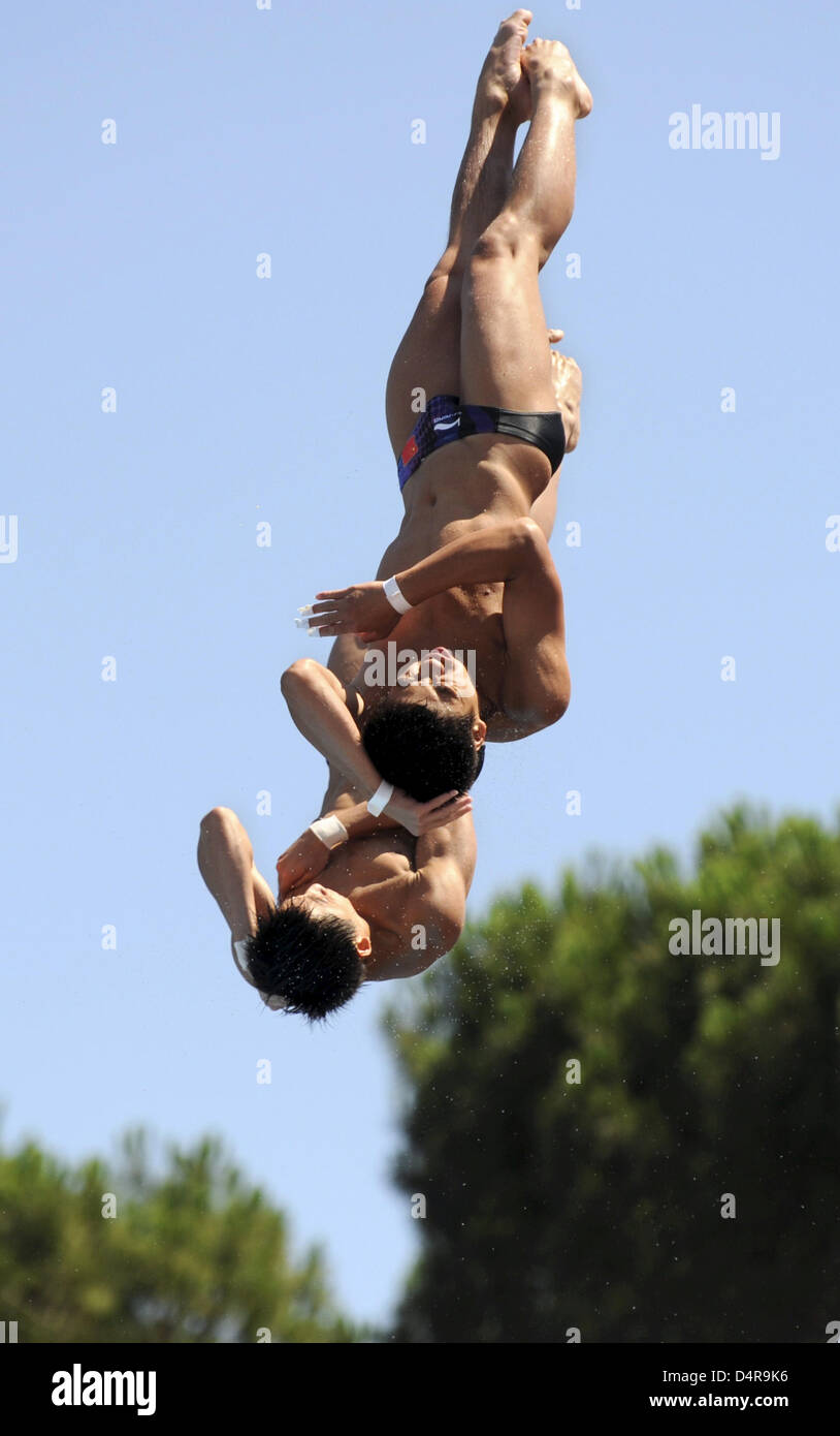 Chinese diving partners Huo Liang and Lin Yue dive off the 10m platform ...