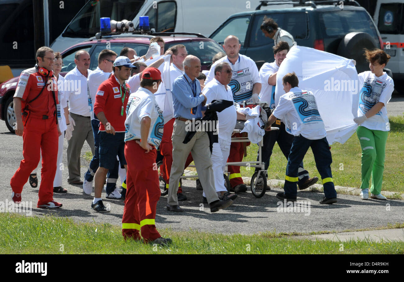 Brazilian Formula One driver Felipe Massa (on the stretcher) of ...