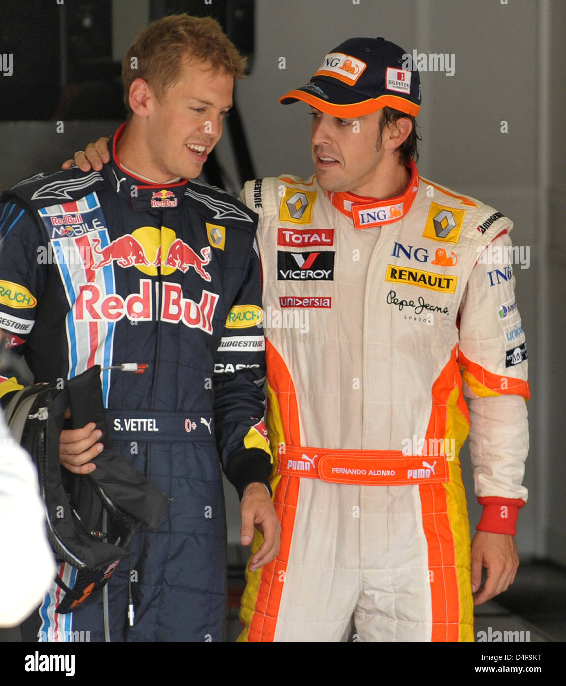 Spanish Formula One driver Fernando Alonso of Renault F1 (R), who ...