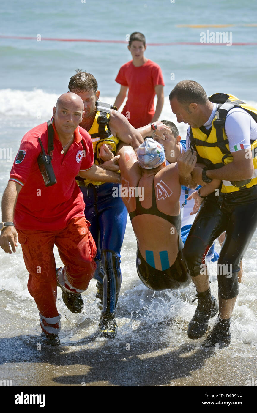 Exhausted Italian open water swimmer Martina Grimaldi is carried after ...