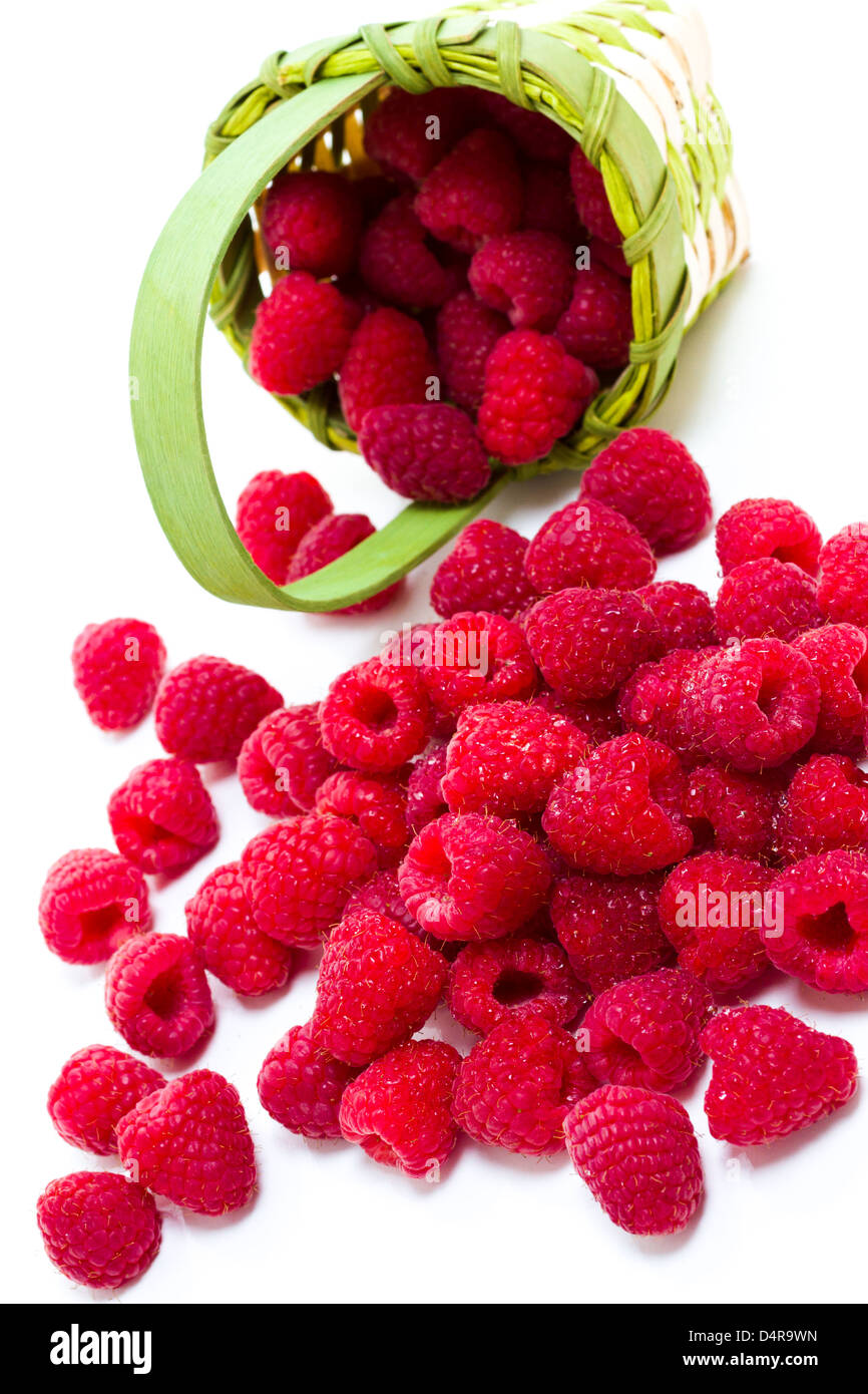 Heap of organic raspberries on white background Stock Photo - Alamy