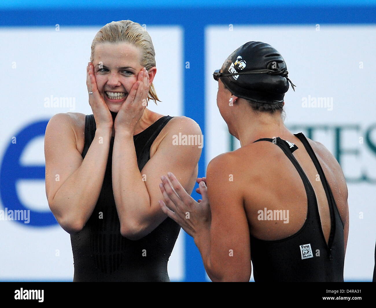 (L-R) Germany?s Britta Steffen, Daniela Samulski cheer winning silver ...