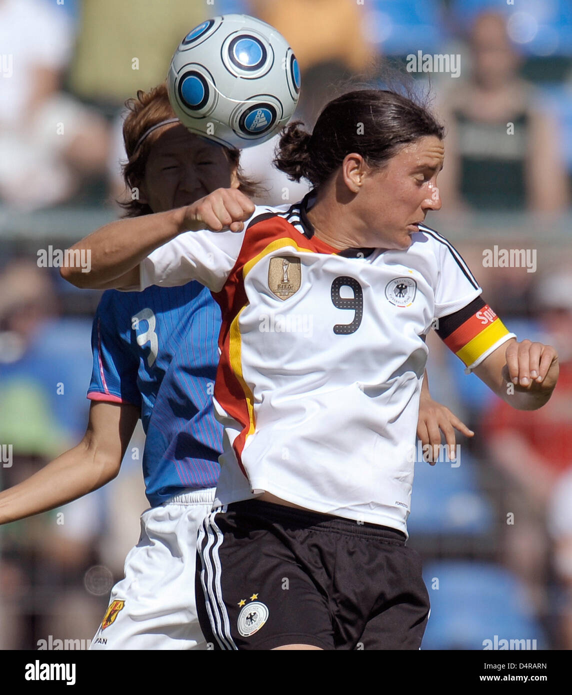 Germany?s Birgit Prinz (R) fights for the ball with Japan?s Azusa ...