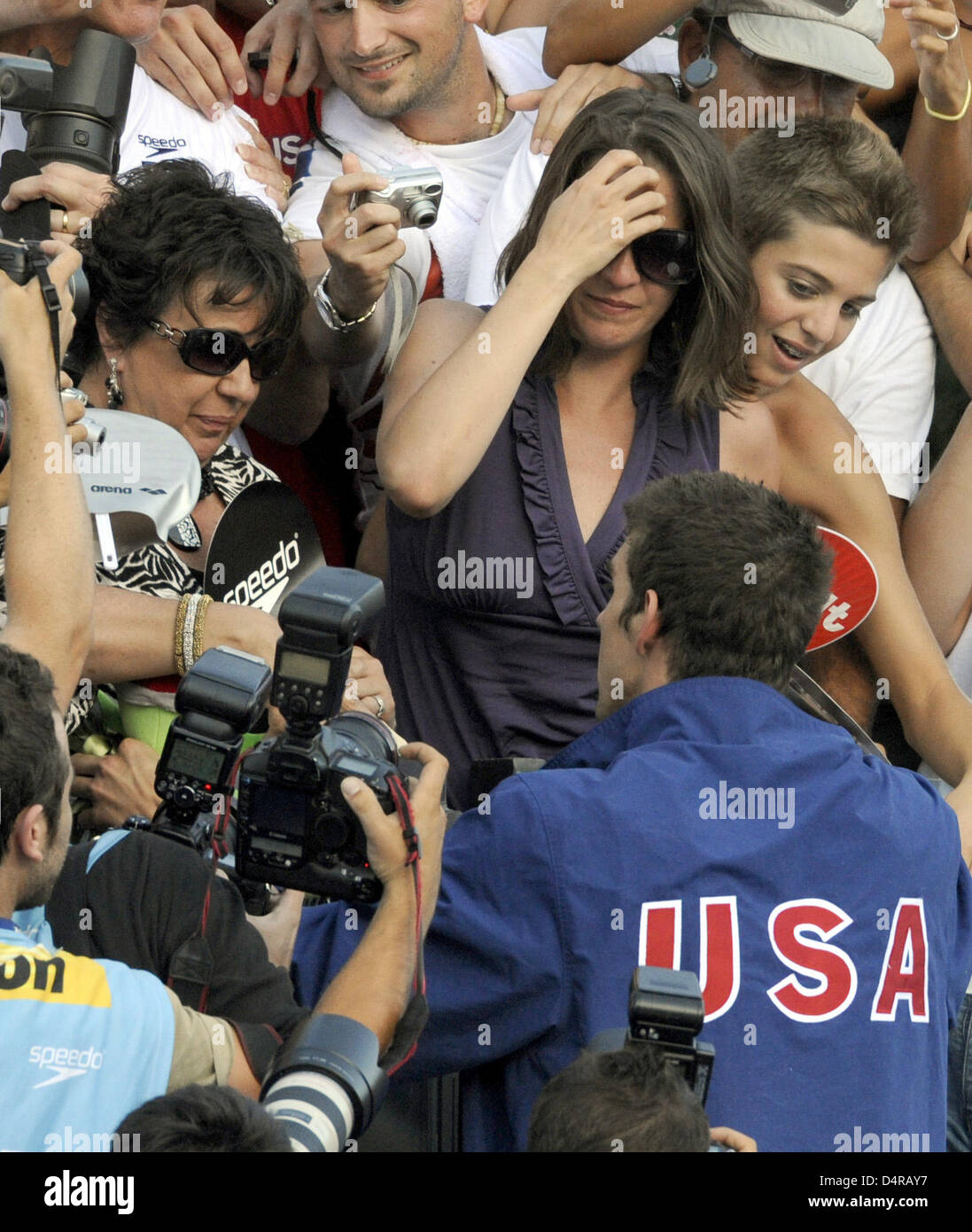 US swimmer Michael Phelps celebrates with his mother Debbie (L) after ...