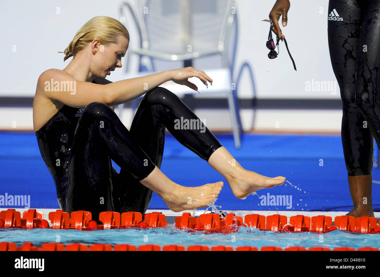 German swimmer Britta Steffen gets out of the pool after the heat of ...