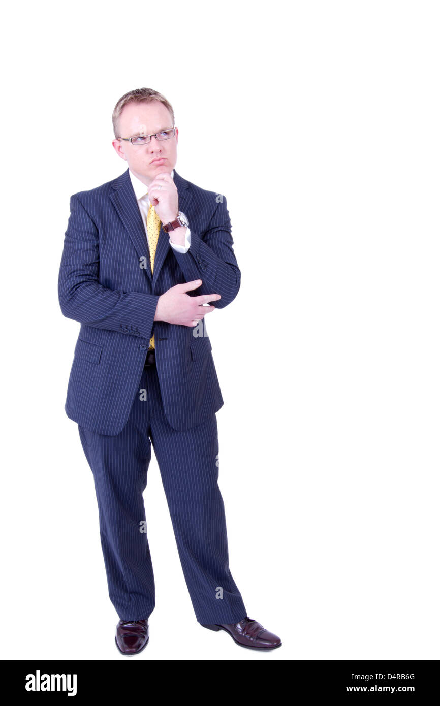 Sharp looking businessman thinking by looking up and his hand on his ...