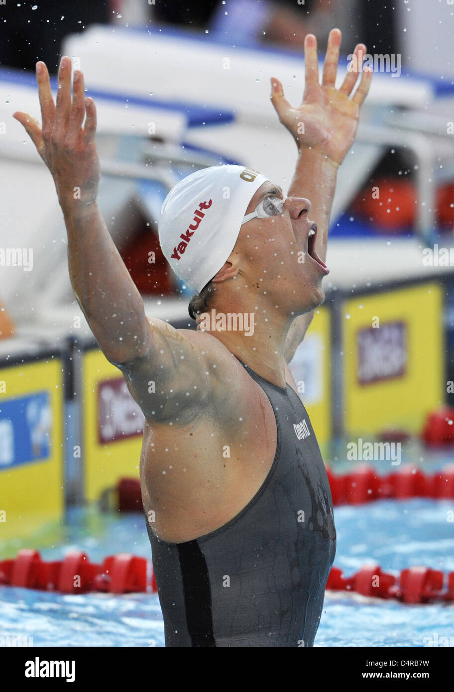 Brazilian swimmer Cesar Cielo Filho cheers about his victory in the men ...
