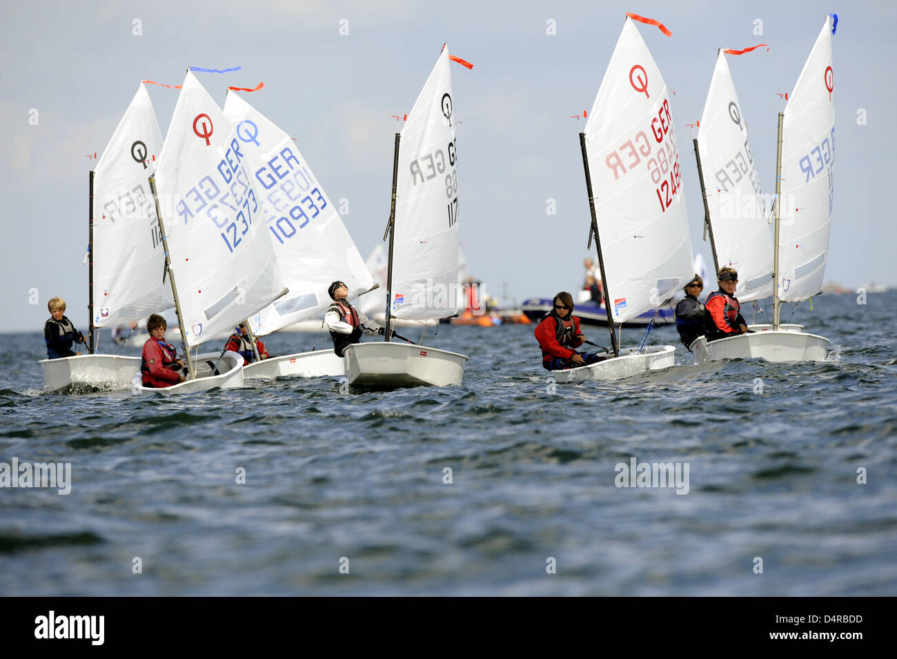 Sailing boats of the optimist class are pictured during a regatta at ...