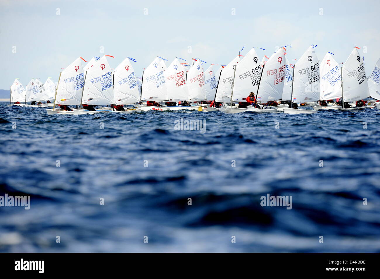 Sailing boats of the optimist class are pictured during a regatta at ...