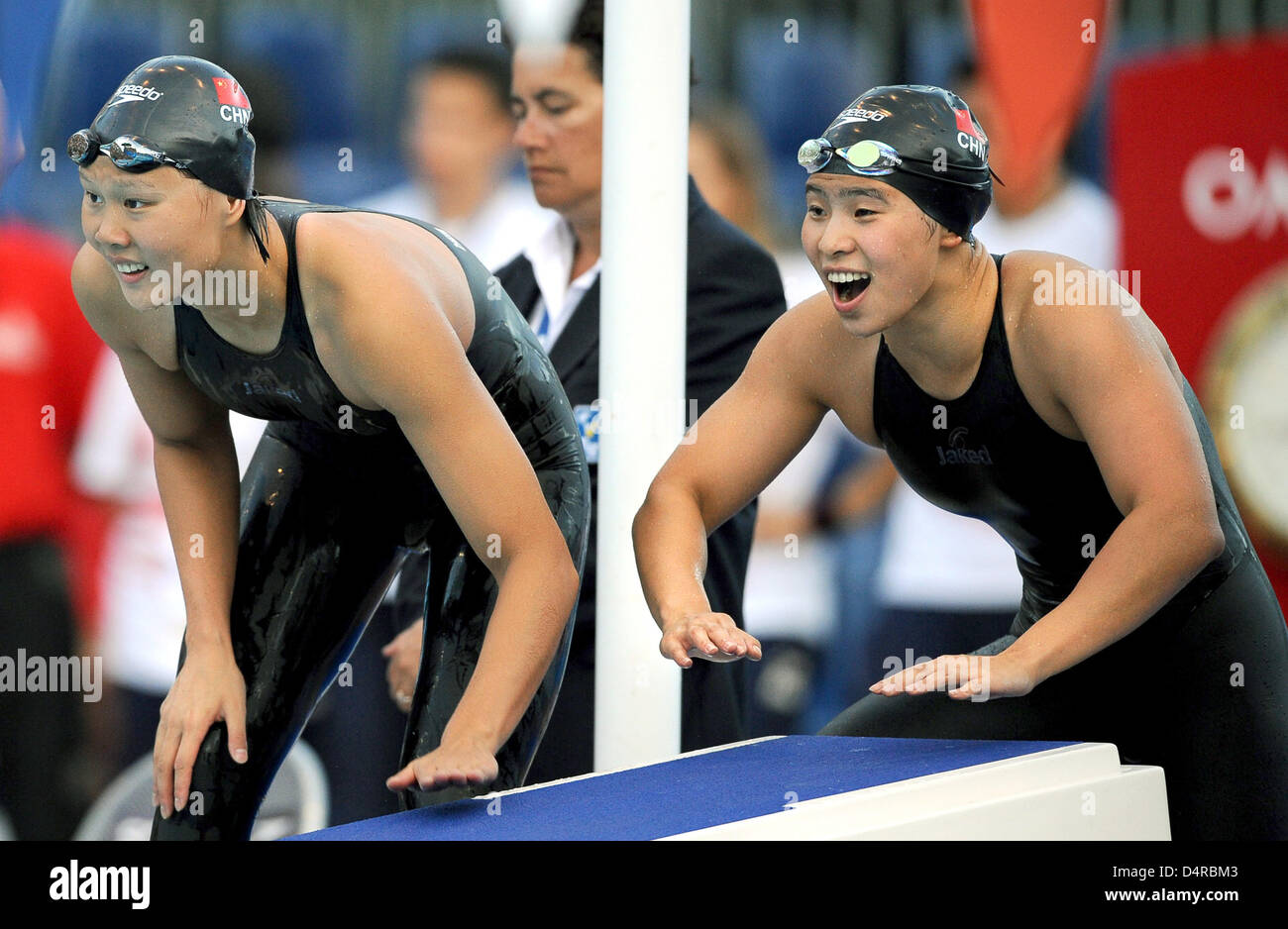Chinese swimmers support their teammate during the women?s 4x100m ...